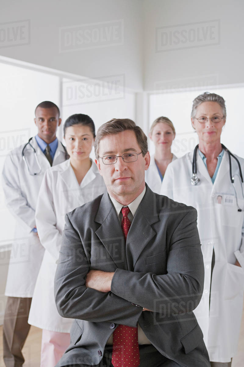 Group portrait of smiling doctors - Royalty-free Stock Photo | Dissolve