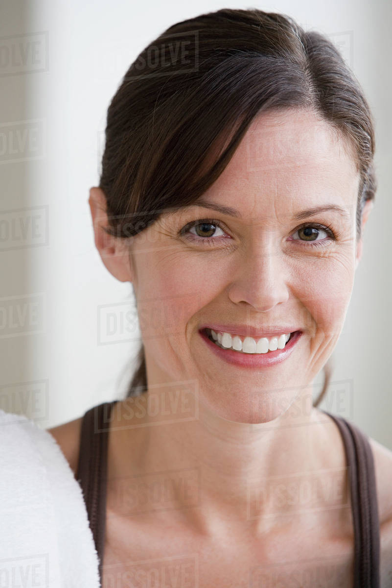 Portrait of woman smiling - Stock Photo - Dissolve