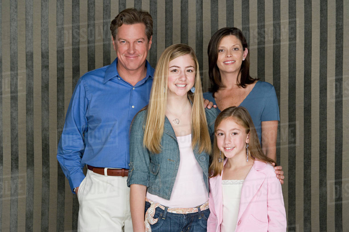 Portrait of happy family with two girls (8-9, 14-15) - Royalty-free ...