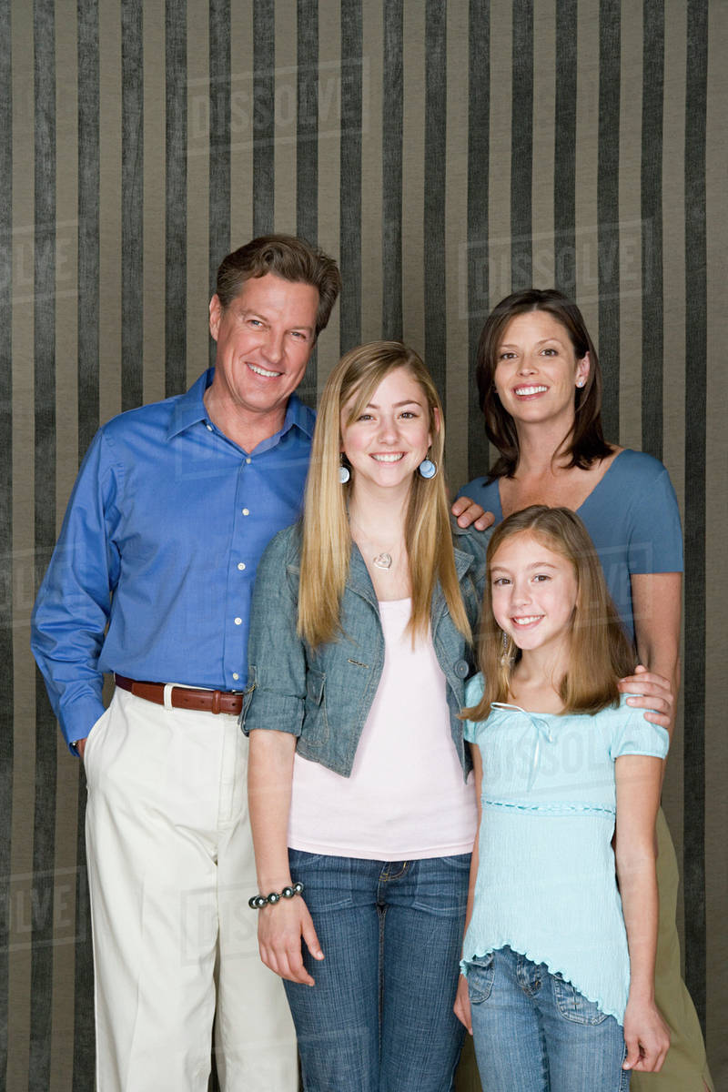 Portrait of two generation family with two daughters (8-9, 14-15 ...