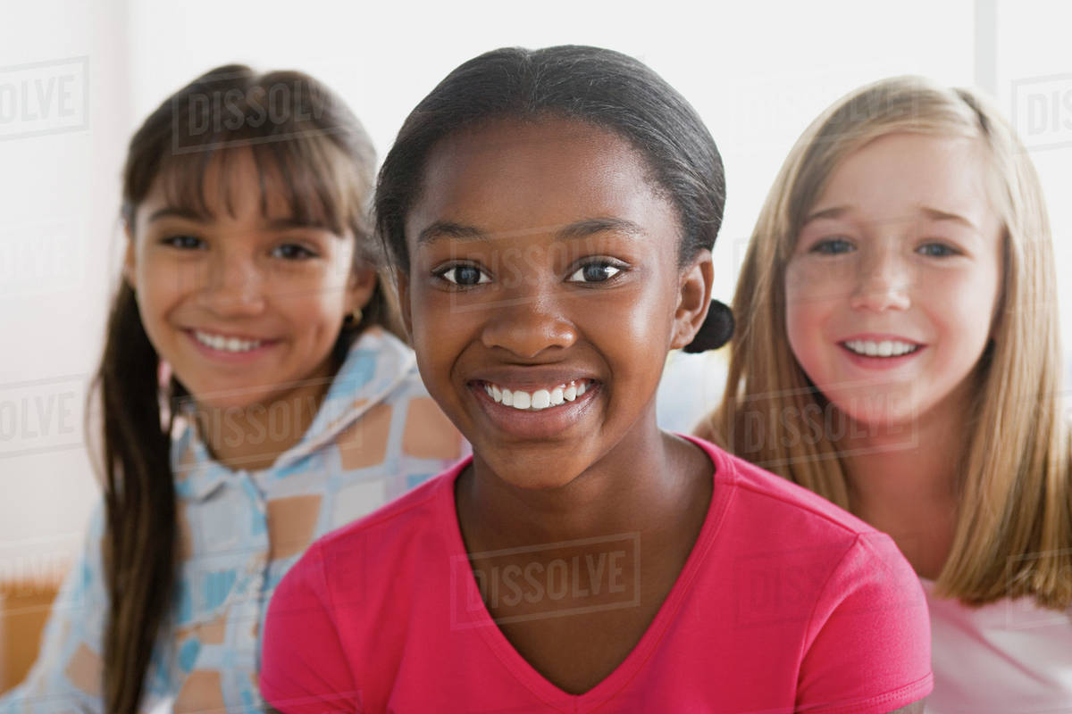 Portrait of three smiling girls (10-11) - Royalty-free Stock Photo ...