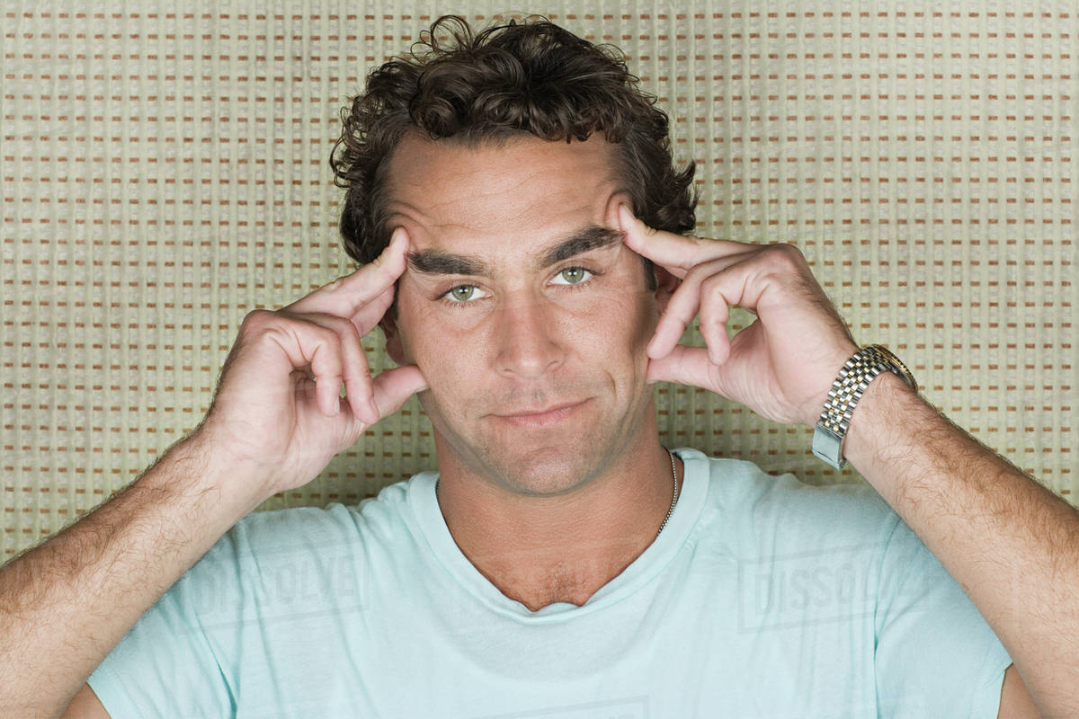 Portrait of man pulling face - Royalty-free Stock Photo | Dissolve