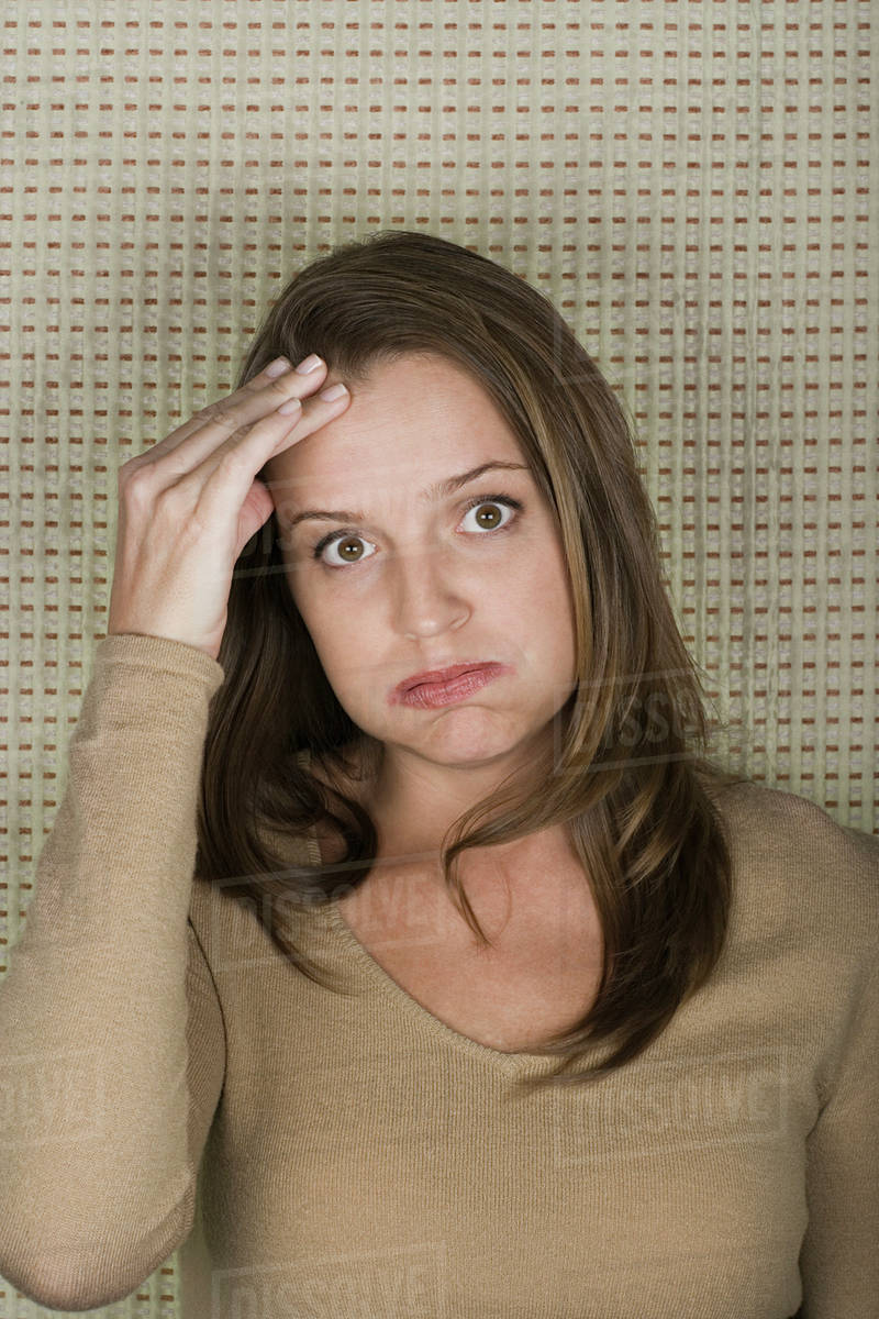 Studio portrait of mature woman pouting - Royalty-free Stock Photo ...