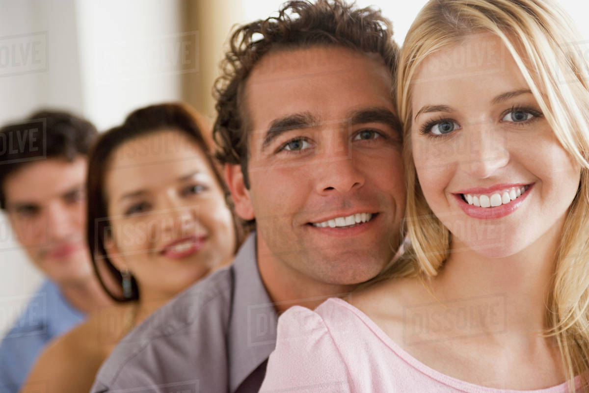 Portrait of two smiling couples - Royalty-free Stock Photo | Dissolve