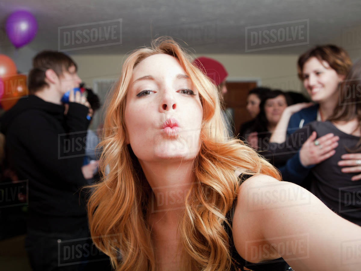 Self portrait of young woman at party - Royalty-free Stock Photo | Dissolve