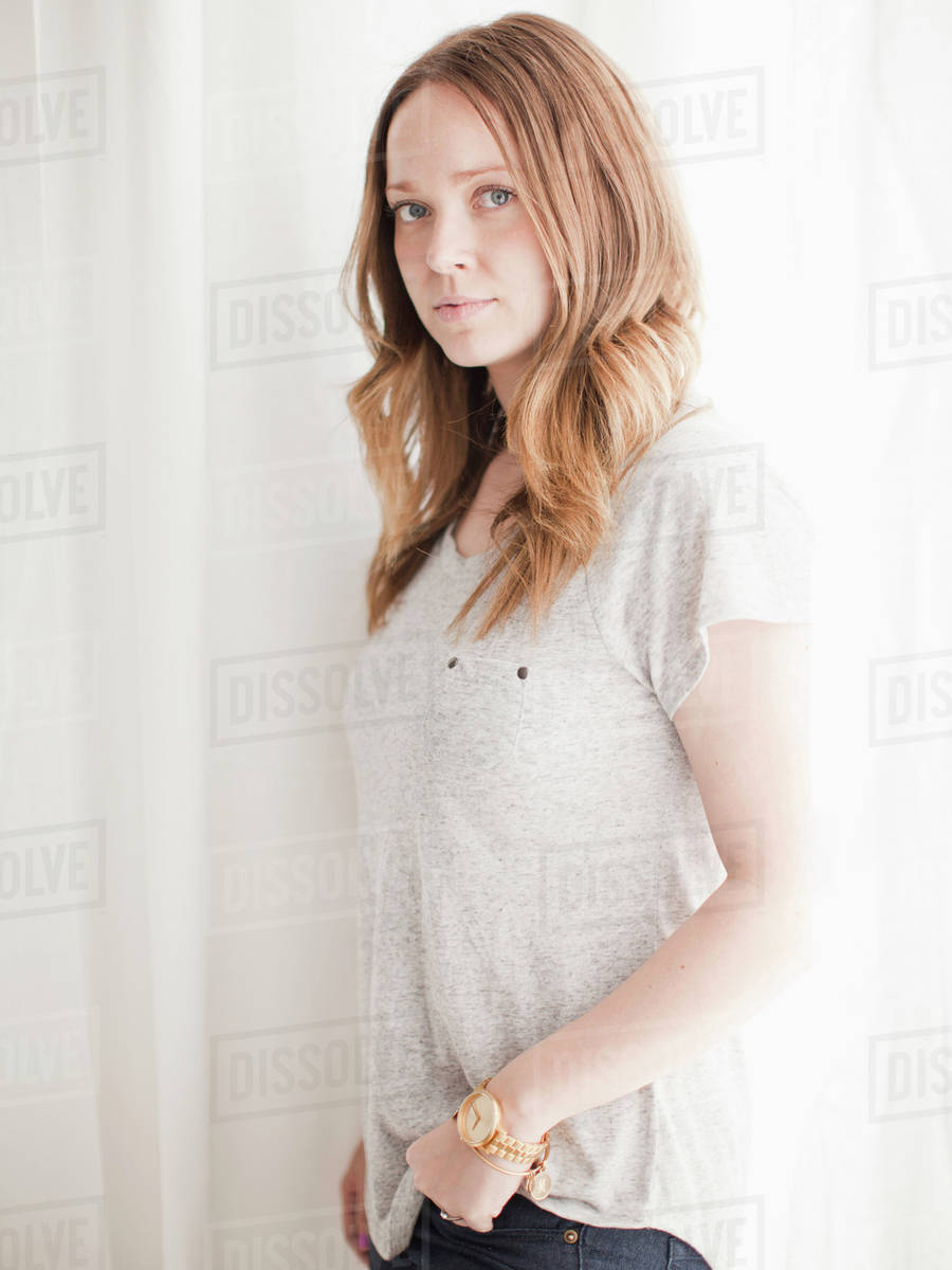 Portrait of serene young woman - Royalty-free Stock Photo | Dissolve
