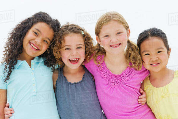 Studio portrait of embracing girls (6-7,8-9) - Royalty-free Stock Photo ...