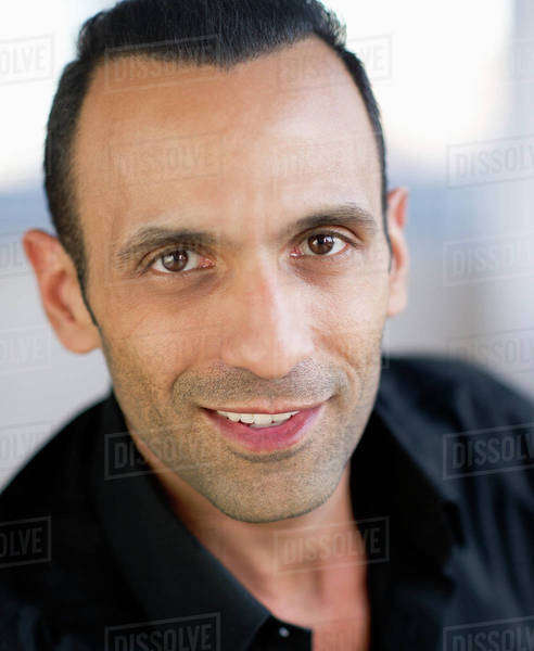 Portrait of smiling mid-adult man - Royalty-free Stock Photo | Dissolve