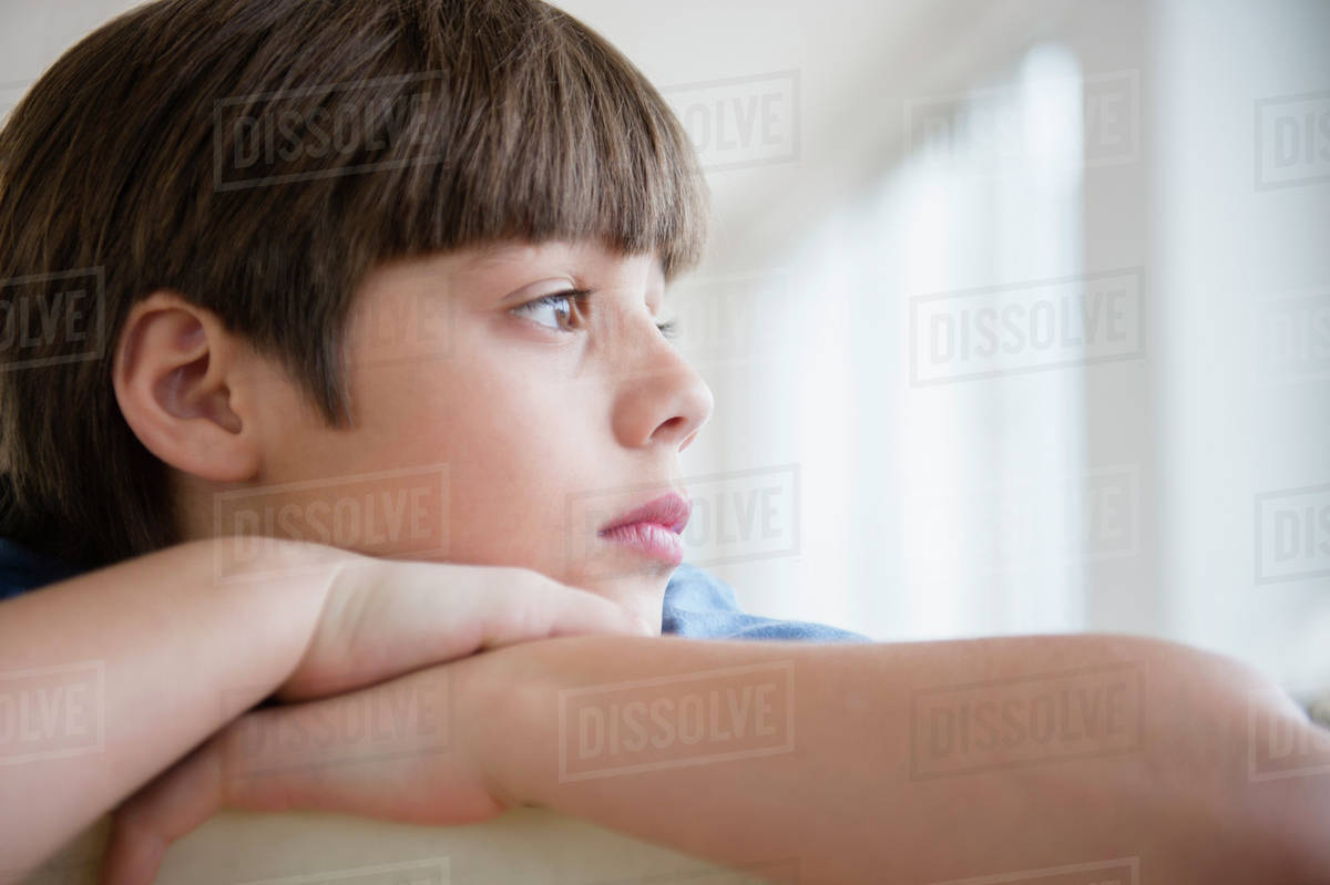 Portrait of pensive boy (8-9) - Royalty-free Stock Photo | Dissolve