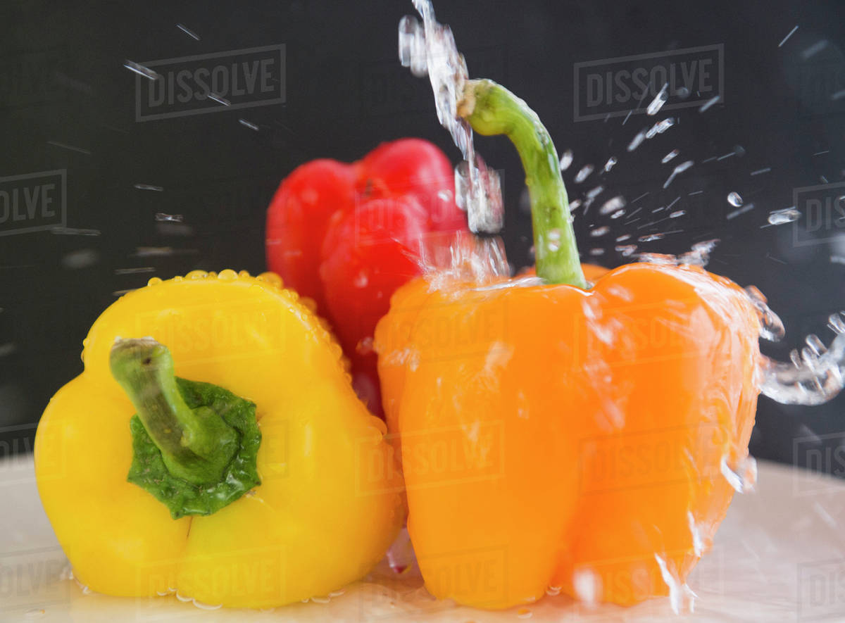 Close up of peppers under water splash, studio shot - Royalty-free ...