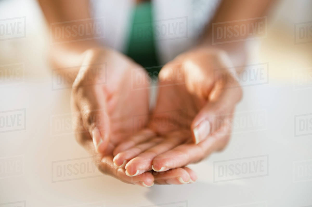 Woman's hands cupped - Royalty-free Stock Photo | Dissolve