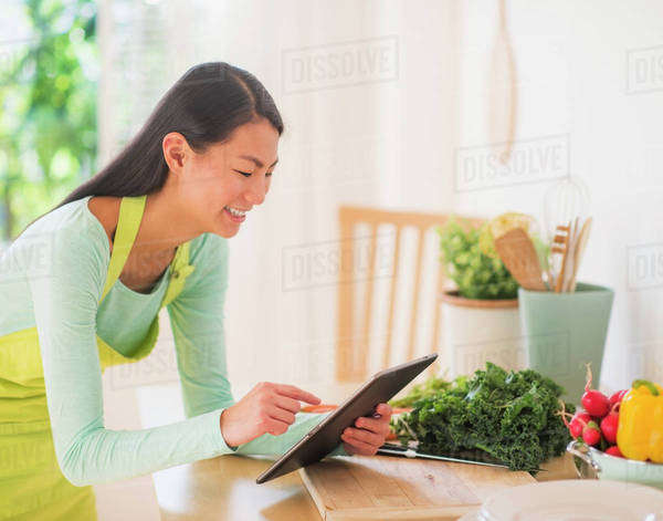 Teenage girl with bunch of vegetables in kitchen - Royalty-free Stock ...