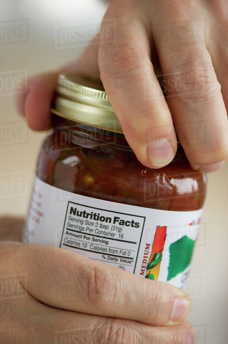 Man opening jar - Royalty-free Stock Photo | Dissolve