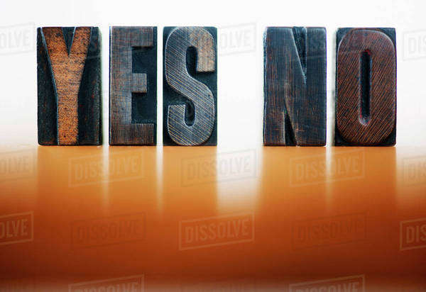 Wooden letter blocks spelling 'yes' and 'no', studio shot - Royalty ...