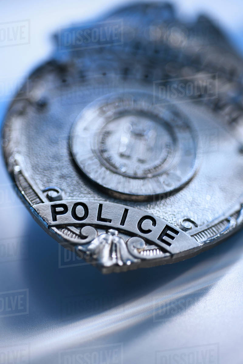 Close-up of police badge, studio shot - Royalty-free Stock Photo | Dissolve