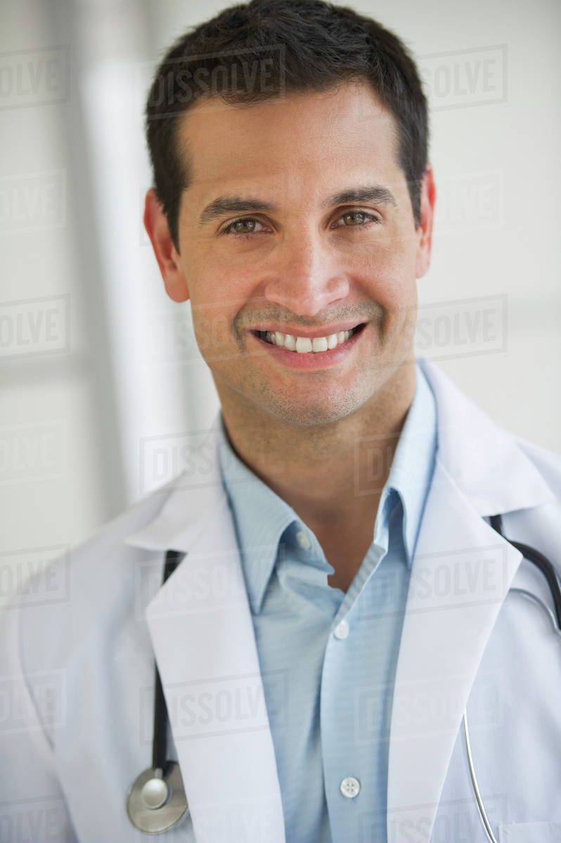 Portrait of doctor smiling - Royalty-free Stock Photo | Dissolve