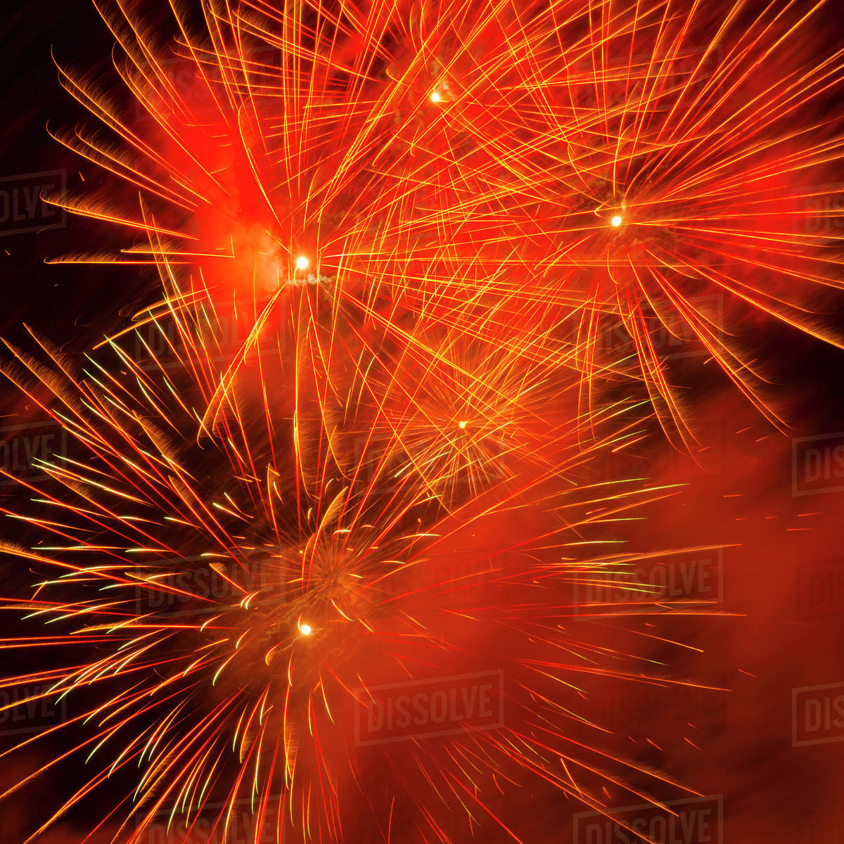 Fireworks explosion against night sky - Royalty-free Stock Photo | Dissolve