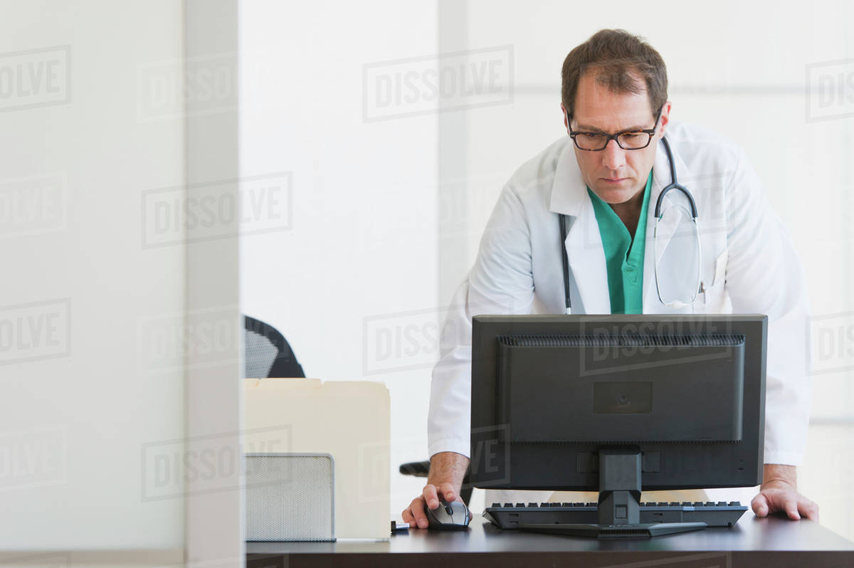 Doctor using computer - Royalty-free Stock Photo | Dissolve
