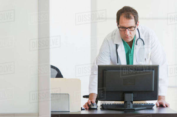 Doctor using computer - Royalty-free Stock Photo | Dissolve