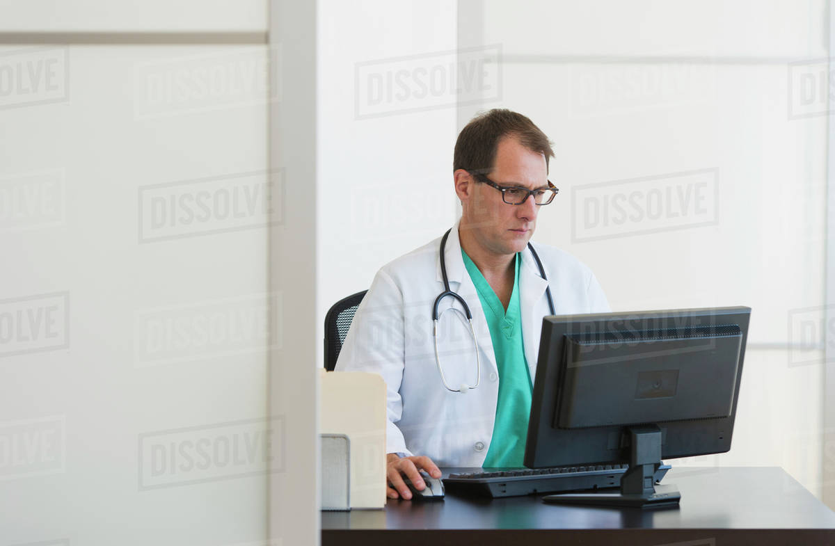 Doctor using computer - Royalty-free Stock Photo | Dissolve