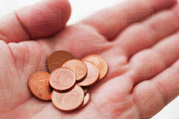 Hand with one cents coins - Royalty-free Stock Photo | Dissolve