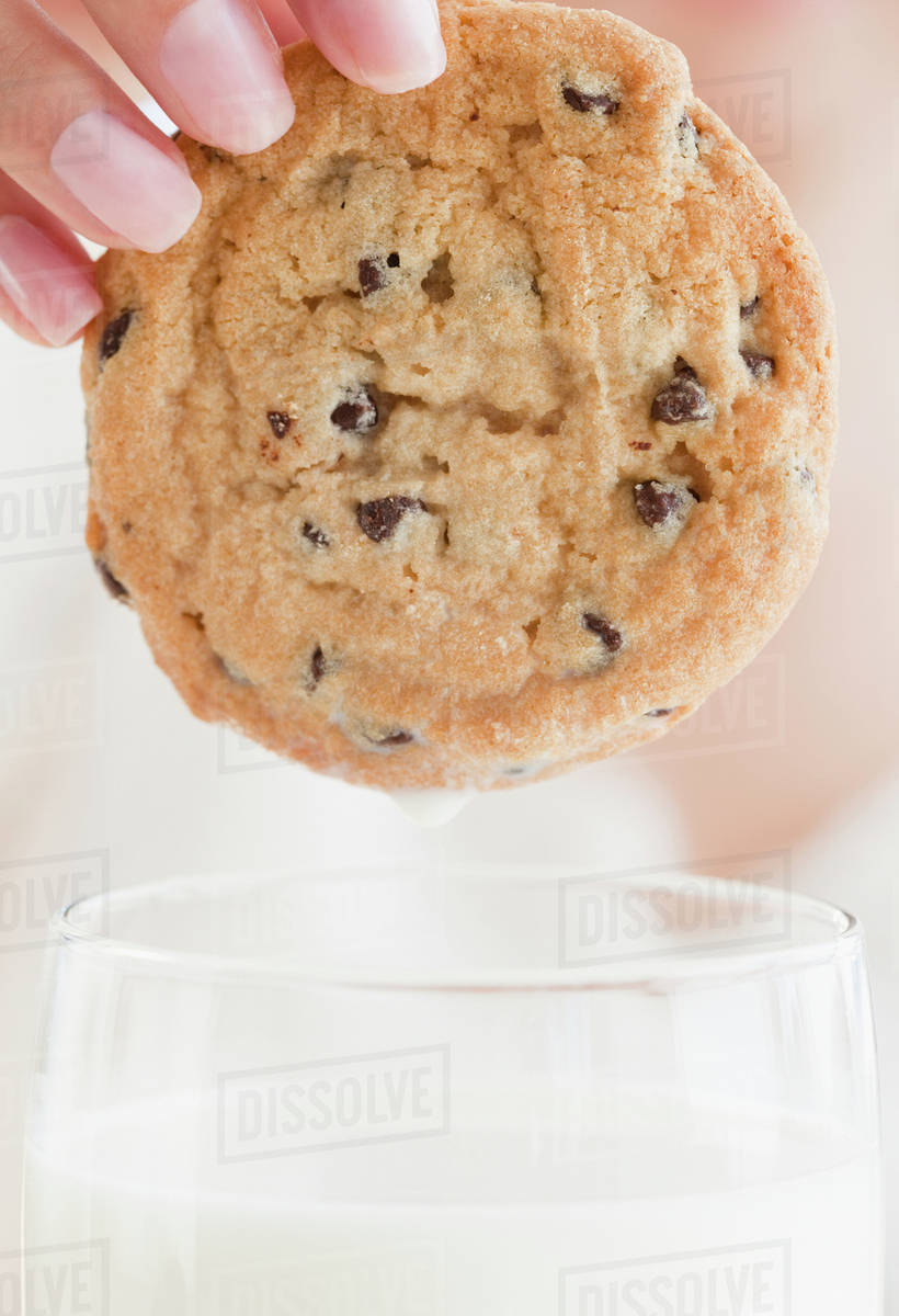 Close up of woman's hand holding cookie - Royalty-free Stock Photo ...