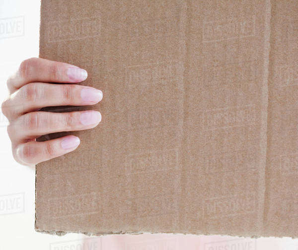 Close up of woman's hand holding cardboard - Royalty-free Stock Photo ...