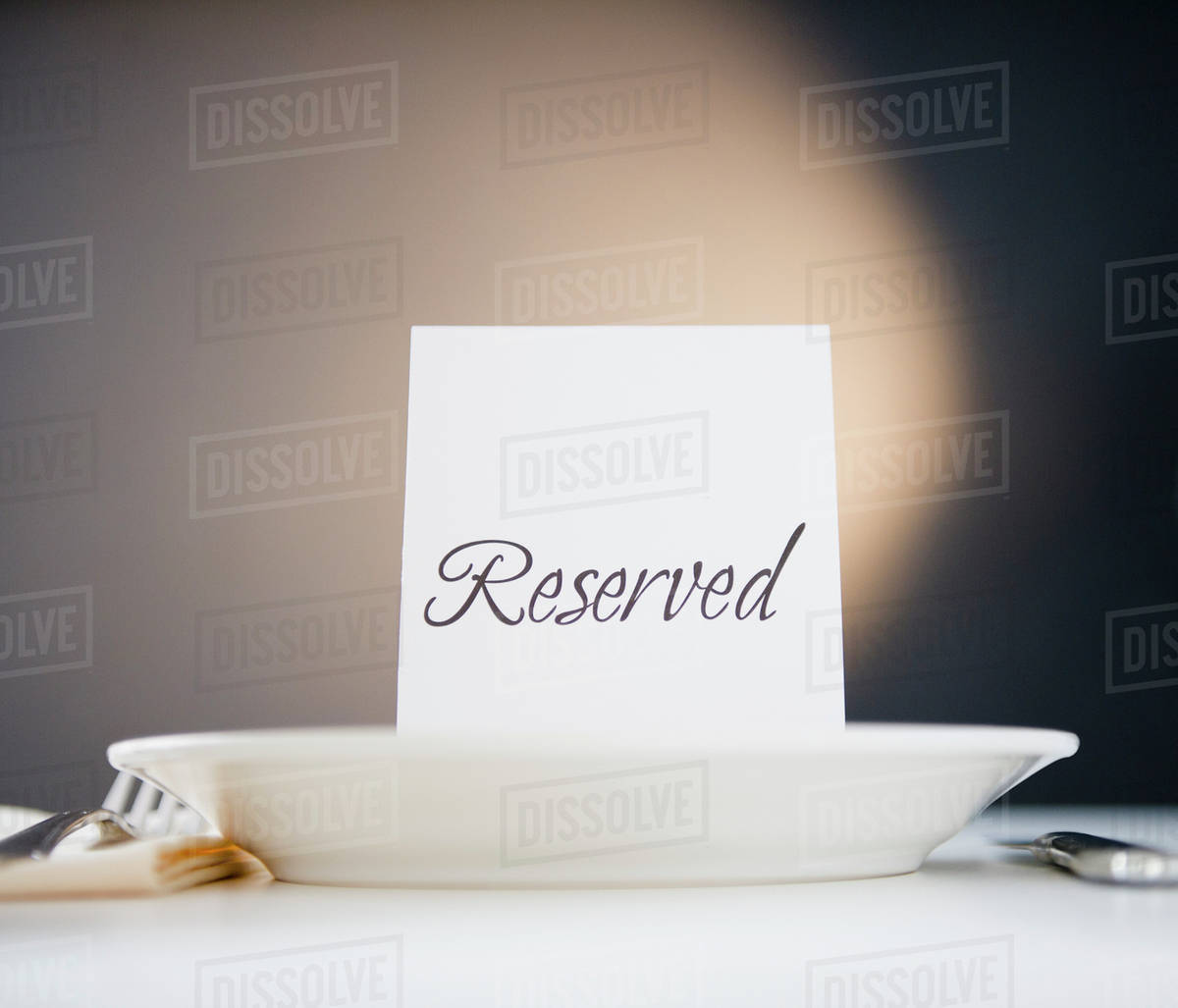 Reserved sign on place setting, studio shot - Royalty-free Stock Photo ...