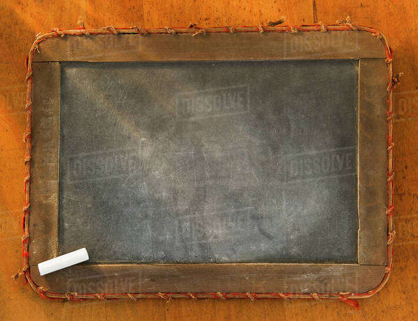 Empty chalkboard with chalk, studio shot - Stock Photo - Dissolve