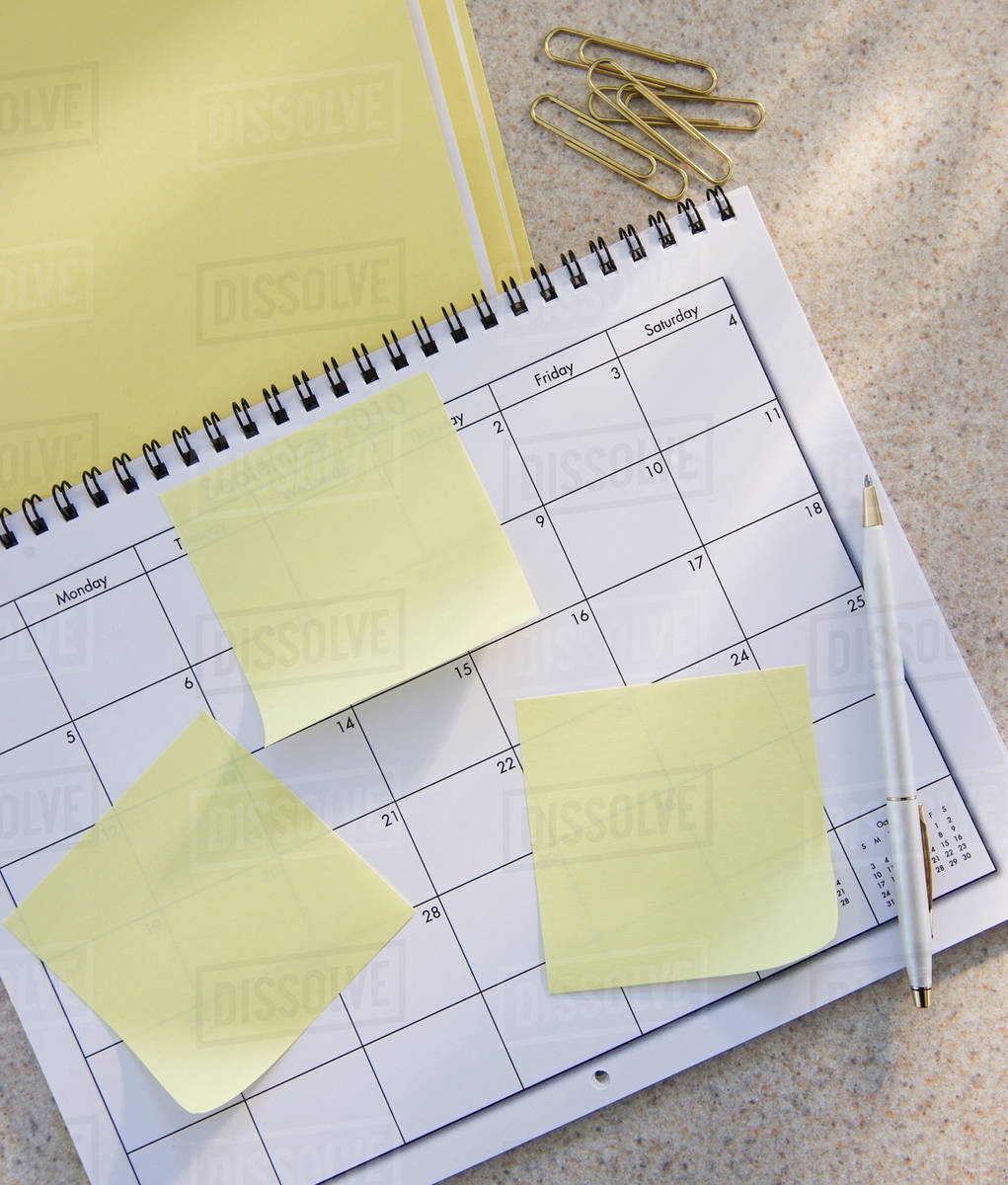 Blank adhesive notes on calendar - Royalty-free Stock Photo | Dissolve