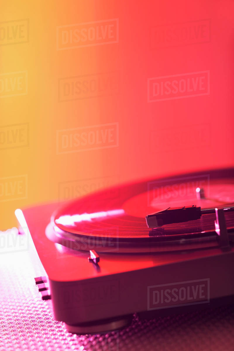 Close up of turntable on colored background - Stock Photo - Dissolve