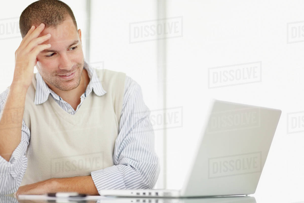 South Africa, Portrait of young man with laptop - Royalty-free Stock ...