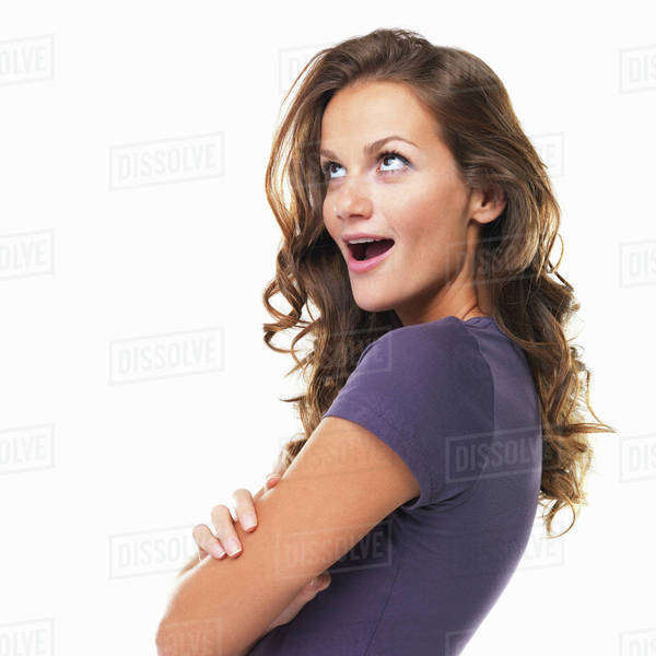 Studio portrait of beautiful woman looking surprised - Stock Photo ...