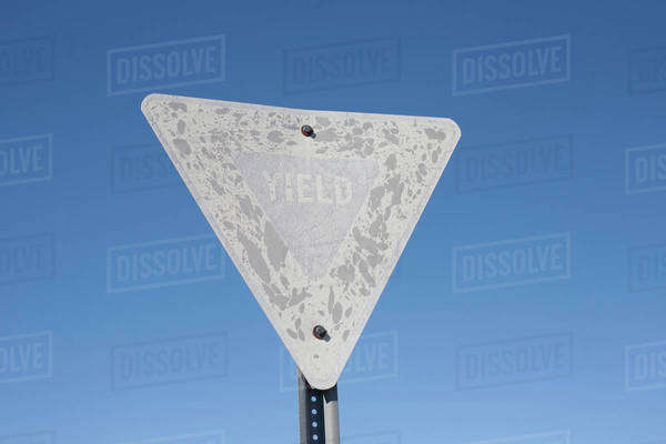 USA, Arizona, Winslow, Old yield sign against blue sky - Royalty-free ...