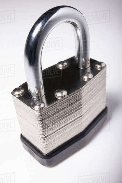 Close-up studio shot of silver padlock - Stock Photo - Dissolve