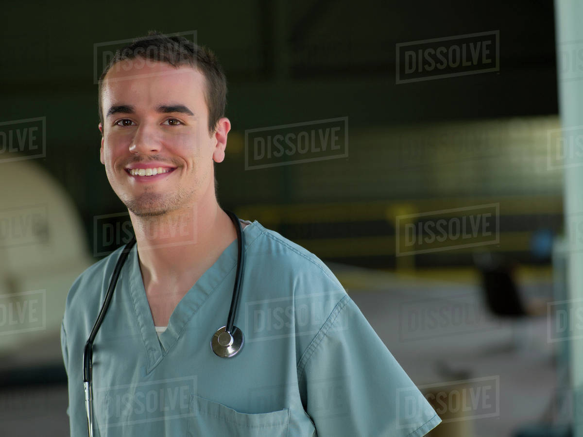 Healthcare worker smiling at camera - Stock Photo - Dissolve