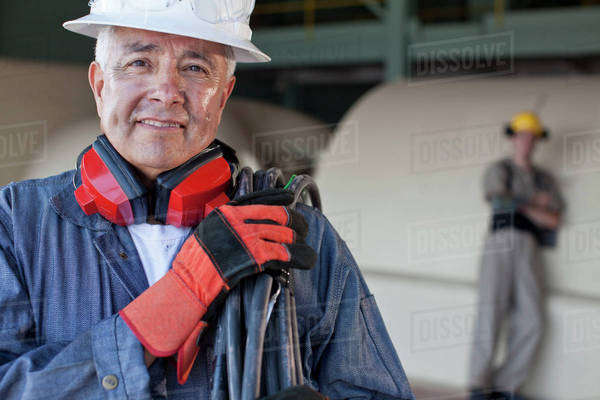 Portrait of male manual worker wearing hardhat - Royalty-free Stock ...