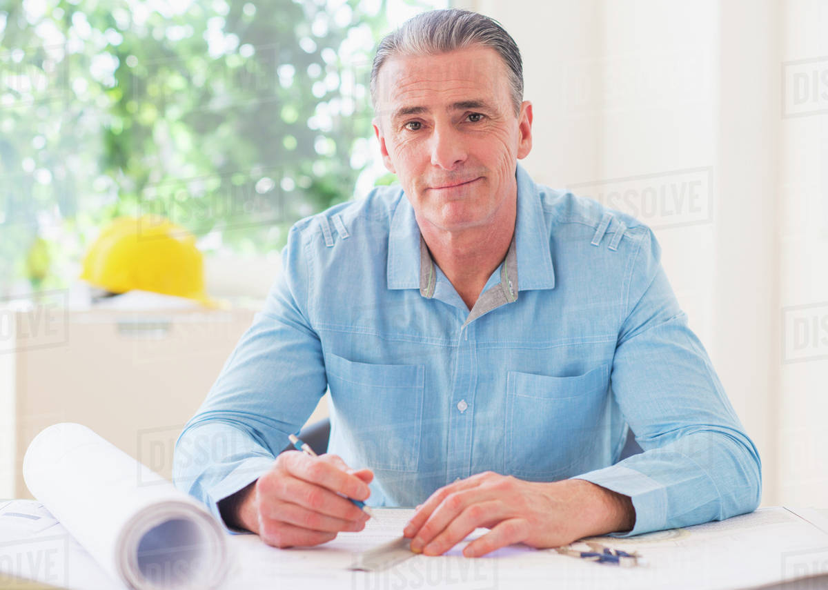 Portrait of man working in office - Royalty-free Stock Photo | Dissolve