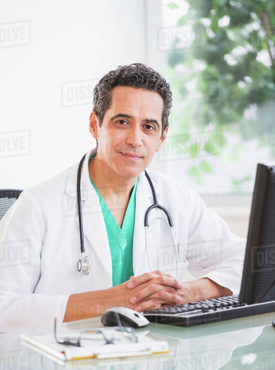 Portrait of doctor in office - Royalty-free Stock Photo | Dissolve