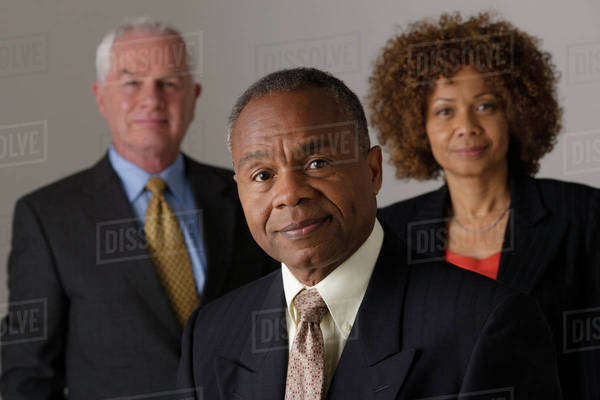 Portrait of three business people, studio shot - Royalty-free Stock ...