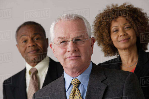 Portrait of three business people, studio shot - Royalty-free Stock ...