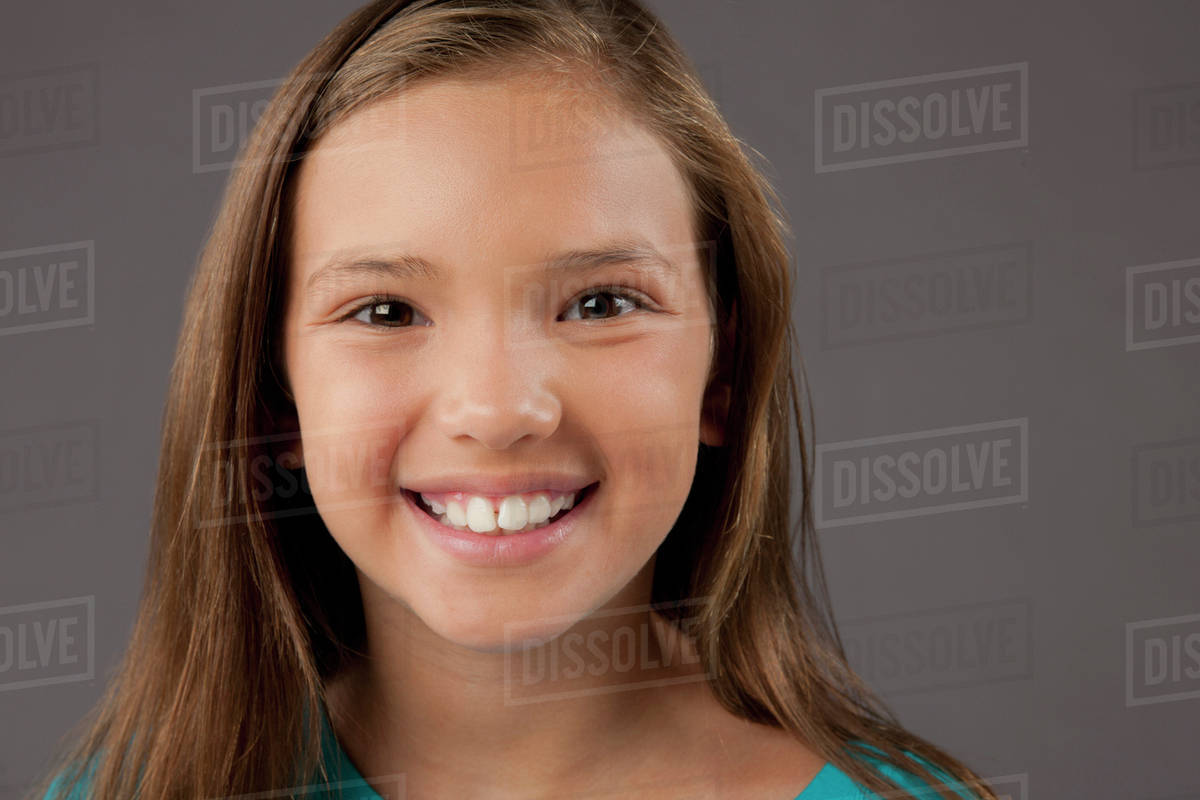 Studio portrait of girl (8-9) - Royalty-free Stock Photo | Dissolve