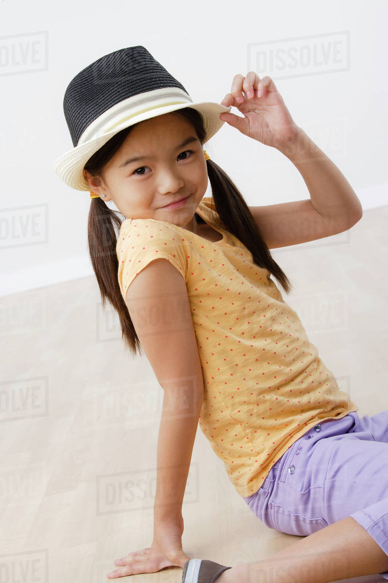 Studio portrait of girl (8-9) wearing hat - Royalty-free Stock Photo ...