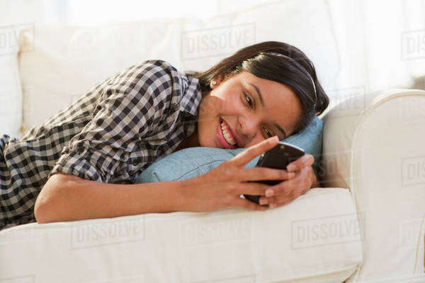 Teenage girl texting - Royalty-free Stock Photo | Dissolve