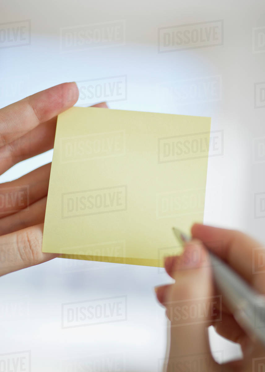 Hands holding notepad and pen - Royalty-free Stock Photo | Dissolve