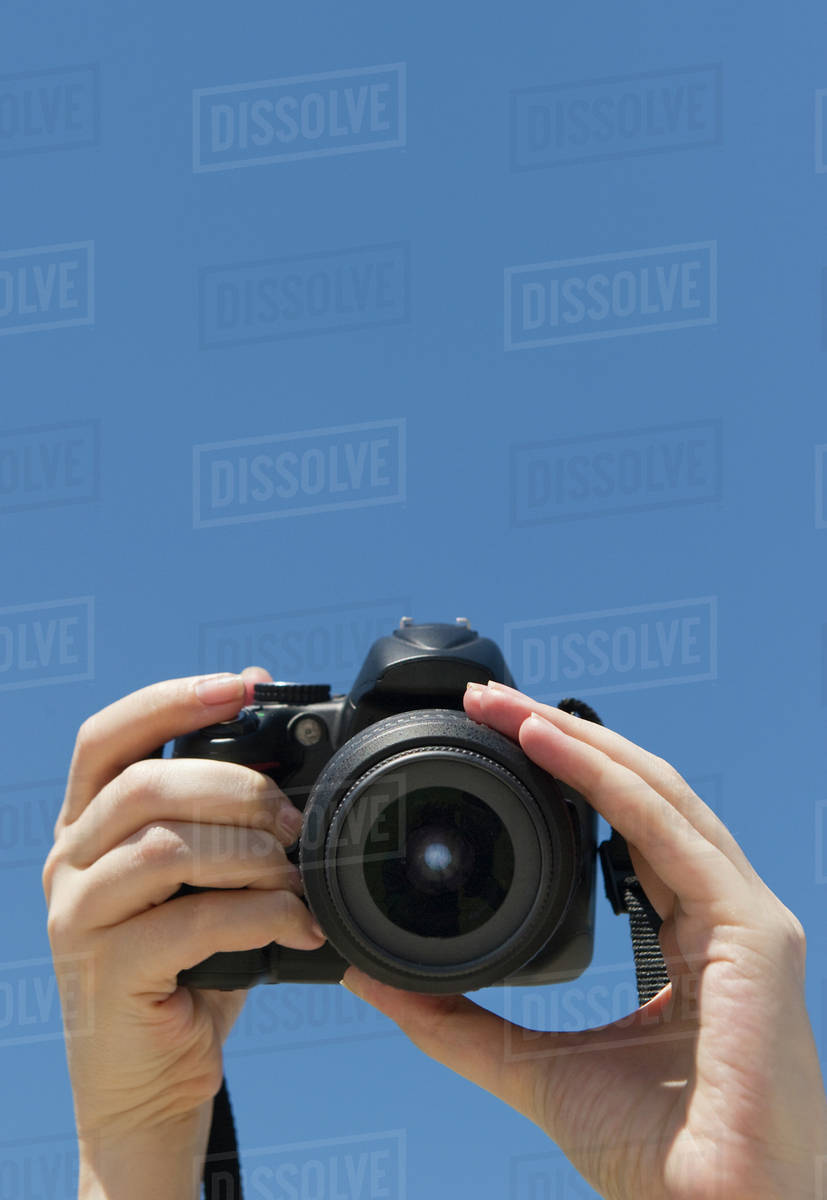 Hands holding a digital camera - Royalty-free Stock Photo | Dissolve