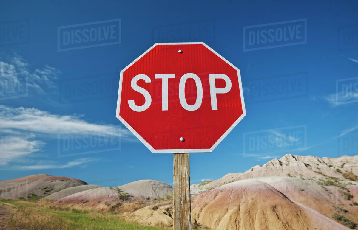 USA, South Dakota, Badlands National Park, Stop sign in mountain ...