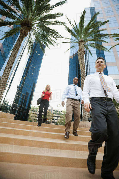 Business people leaving work - Royalty-free Stock Photo | Dissolve