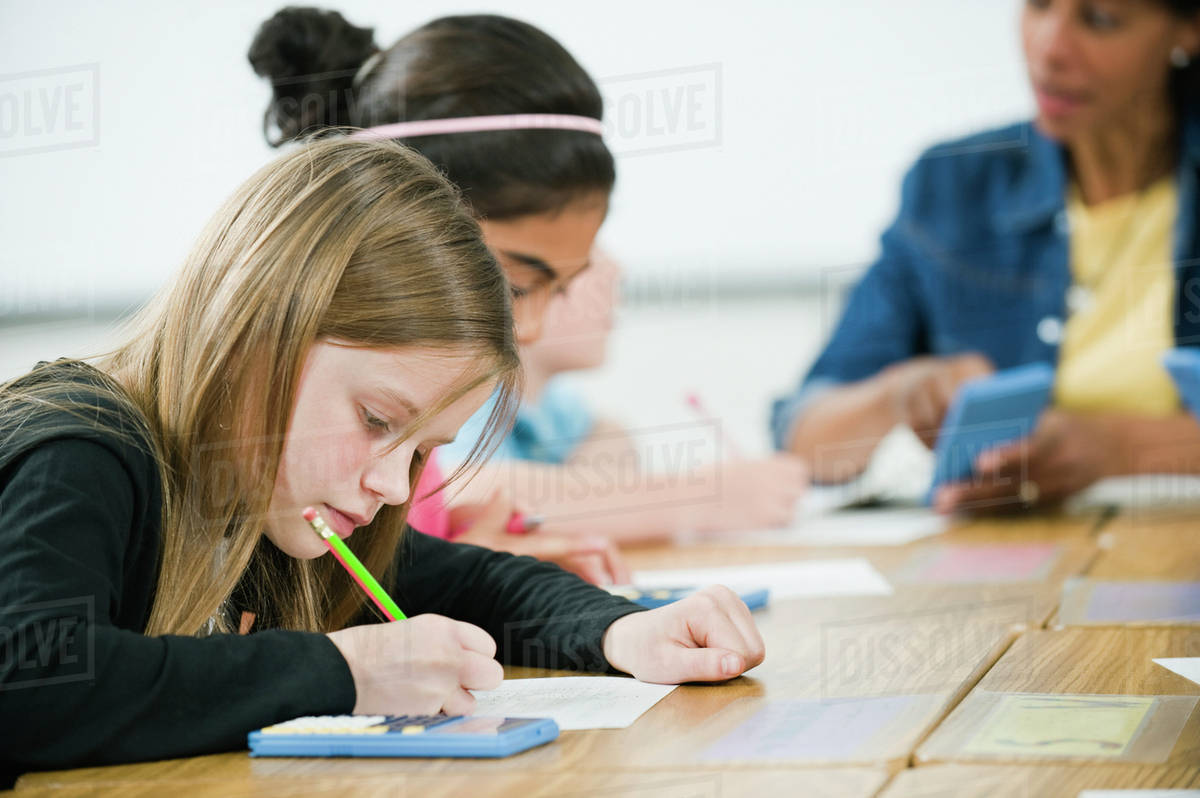 Students doing math work in classroom - Royalty-free Stock Photo | Dissolve