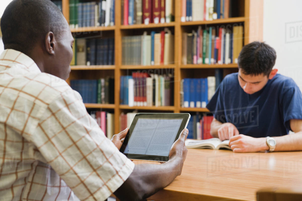 College students in library - Royalty-free Stock Photo | Dissolve
